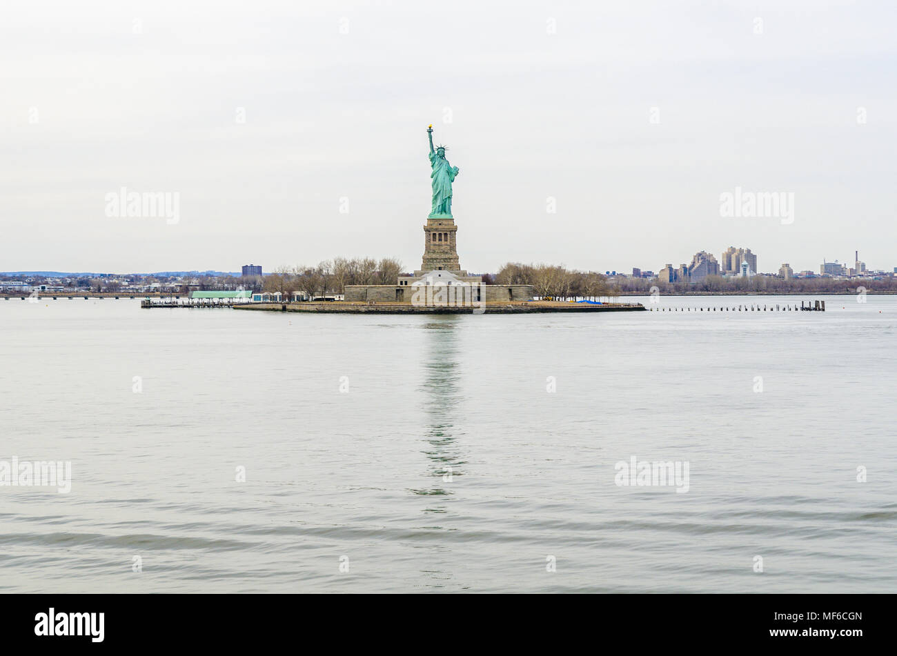 Statue of liberty in the evening, New York with reflection Stock Photo ...