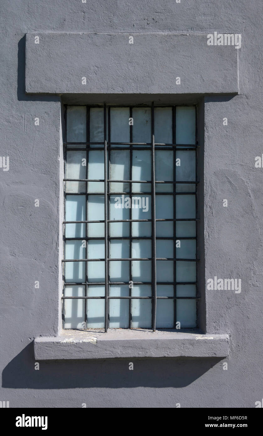 NIS, SERBIA - APRIL 21, 2018: Old gray prison window with metal bars ...