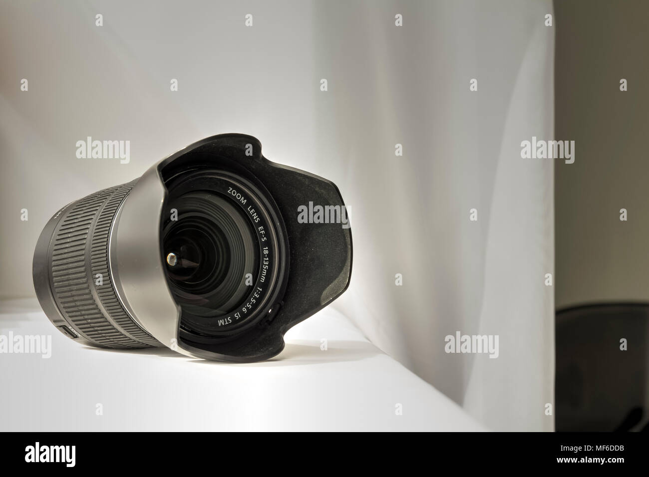 Black camera zoom lens on white cloth Stock Photo - Alamy