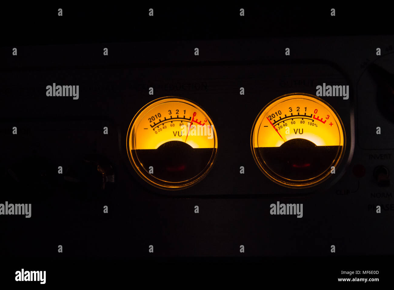 Analog vu meters glowing on black background Stock Photo - Alamy