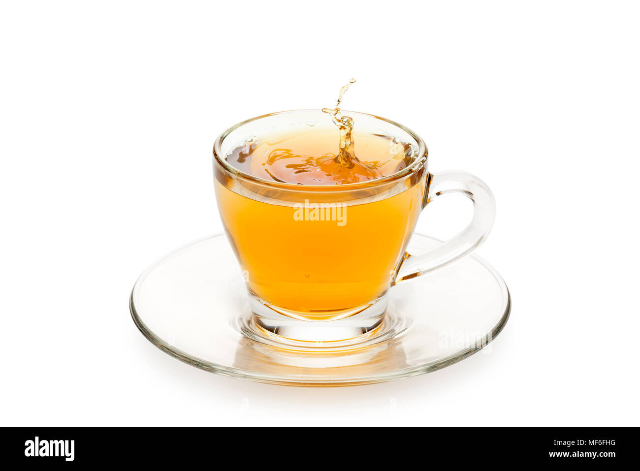 tea in glass cup with drop splashing, on white background Stock Photo ...