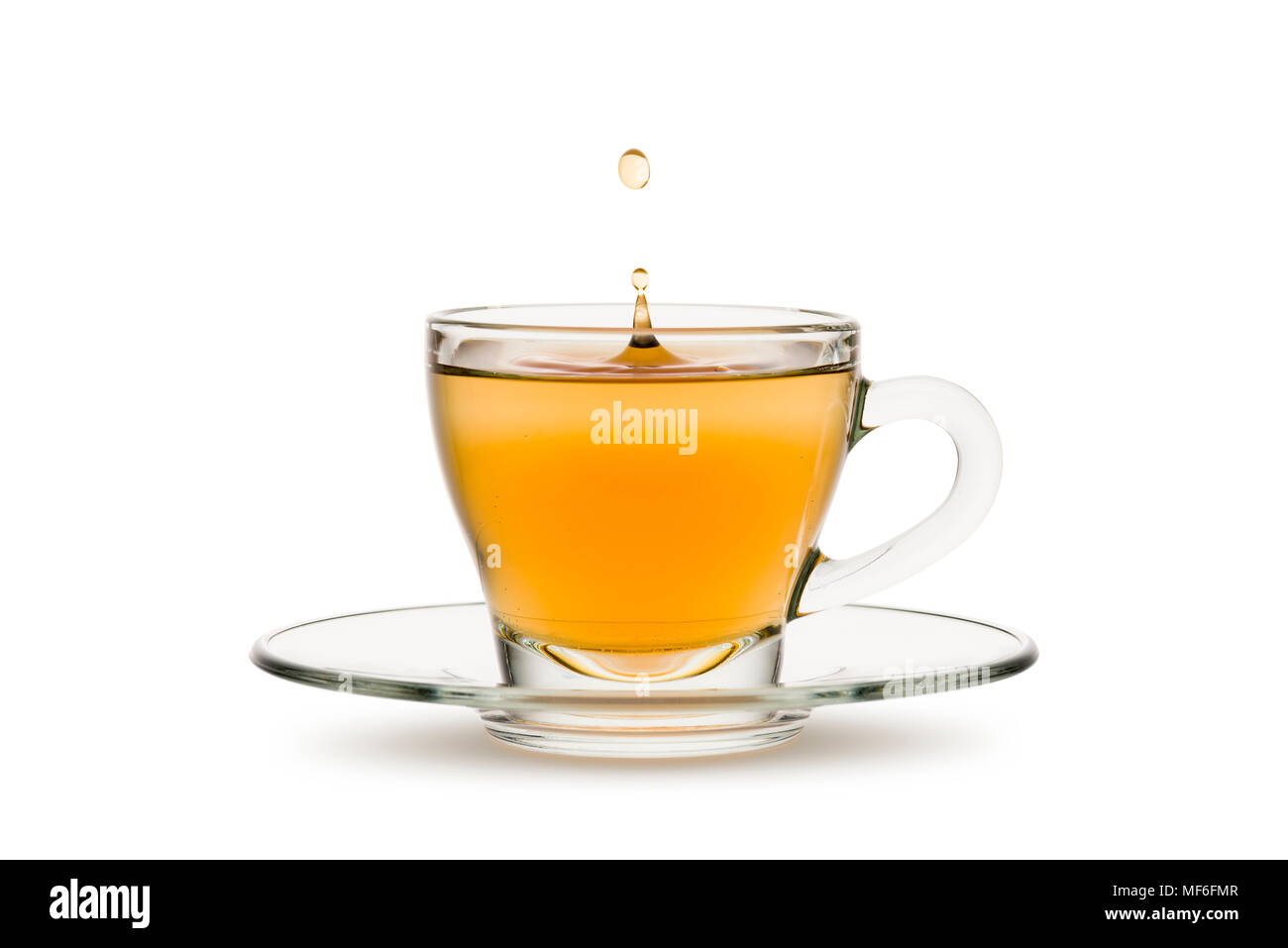 tea in glass cup with drop splashing, on white background Stock Photo ...