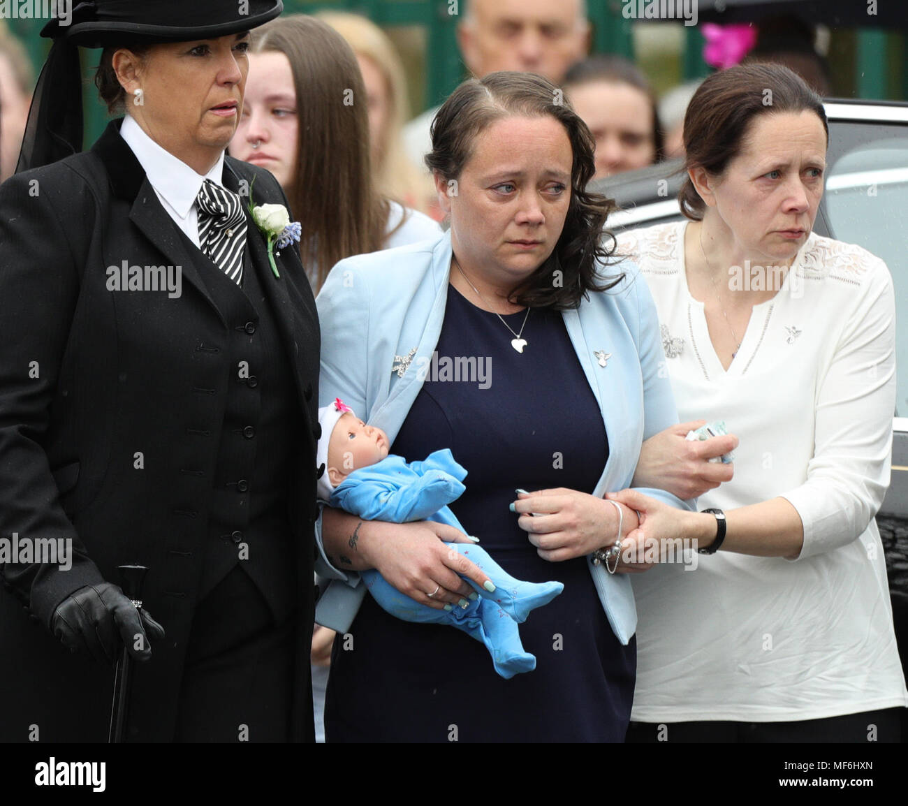 Mylee Billingham's mother Tracey Taundry holds a doll as she arrives at ...