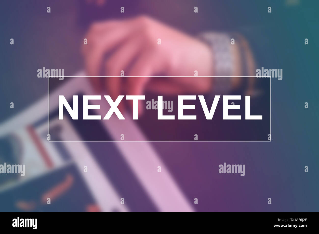 Next level word with blurring business background Stock Photo - Alamy