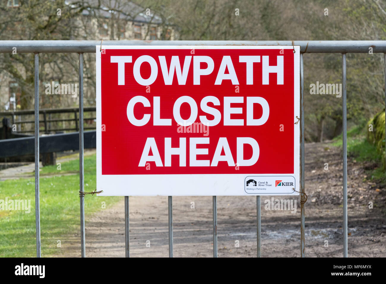 A sign on a barrier placed across the towpath of the Rochdale Canal at ...
