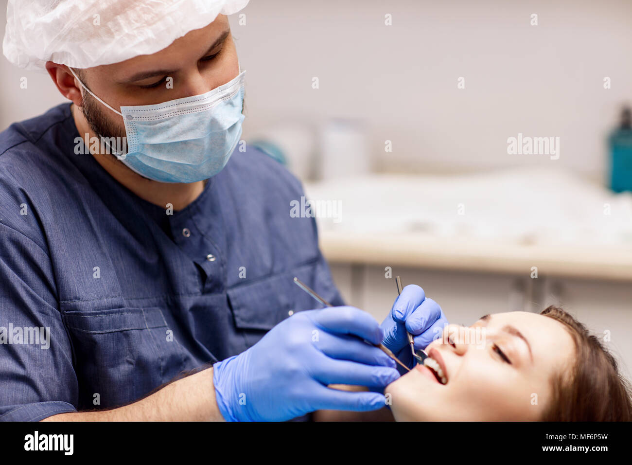 Dentist check-up teeth to young woman patient in clinic Stock Photo - Alamy