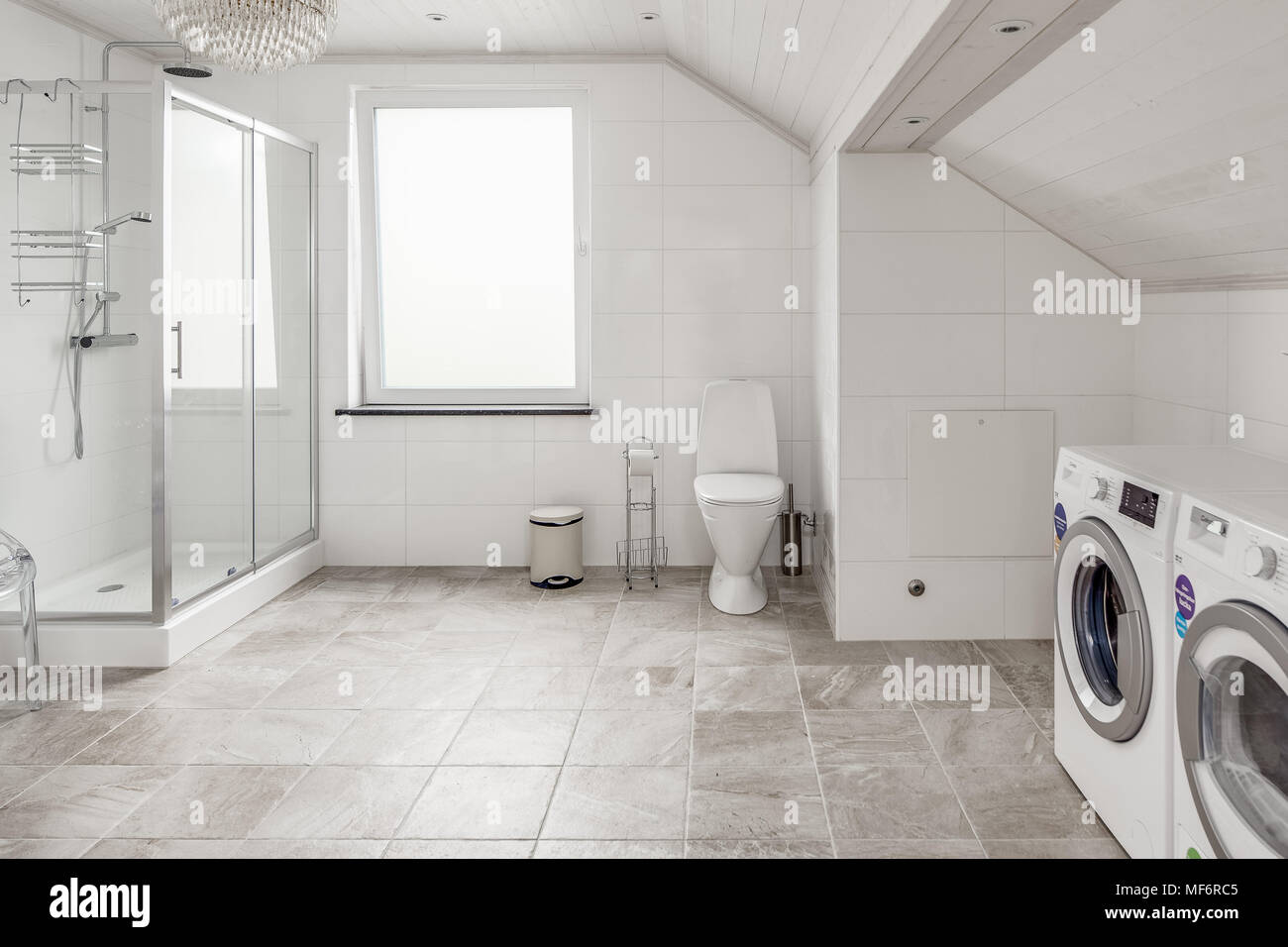 White bathroom with shower and washing machine Stock Photo - Alamy
