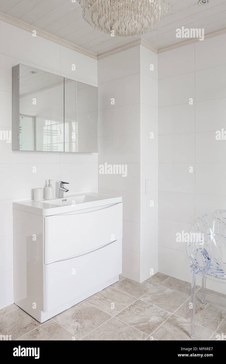 White bathroom commode Stock Photo - Alamy