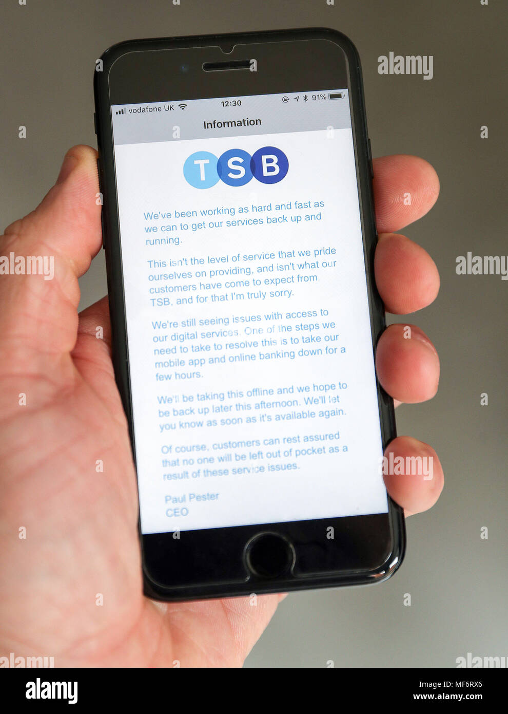 A customer using the TSB Online banking app on an iPhone reads a ...