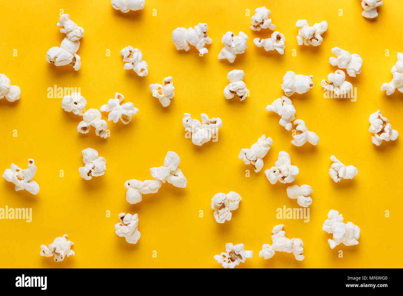 Popcorn on a yellow background. Horizontal image. Top view Stock Photo ...