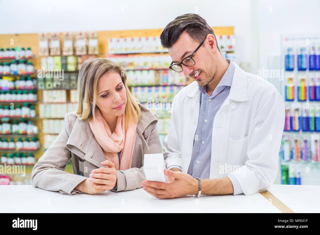 Pharmacy shop giving customer hi-res stock photography and images - Alamy