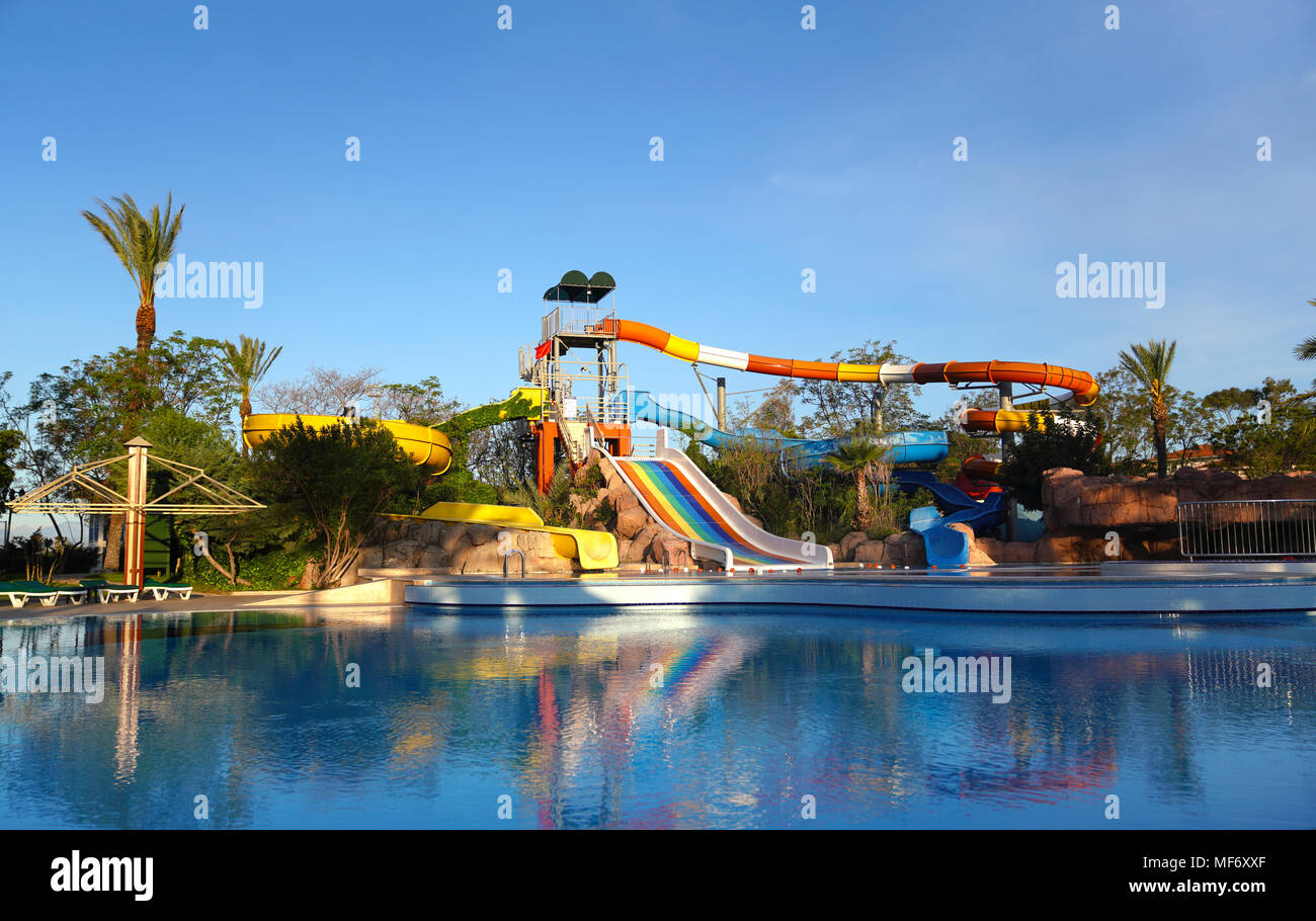 Water park reflection in swimming pool Stock Photo - Alamy