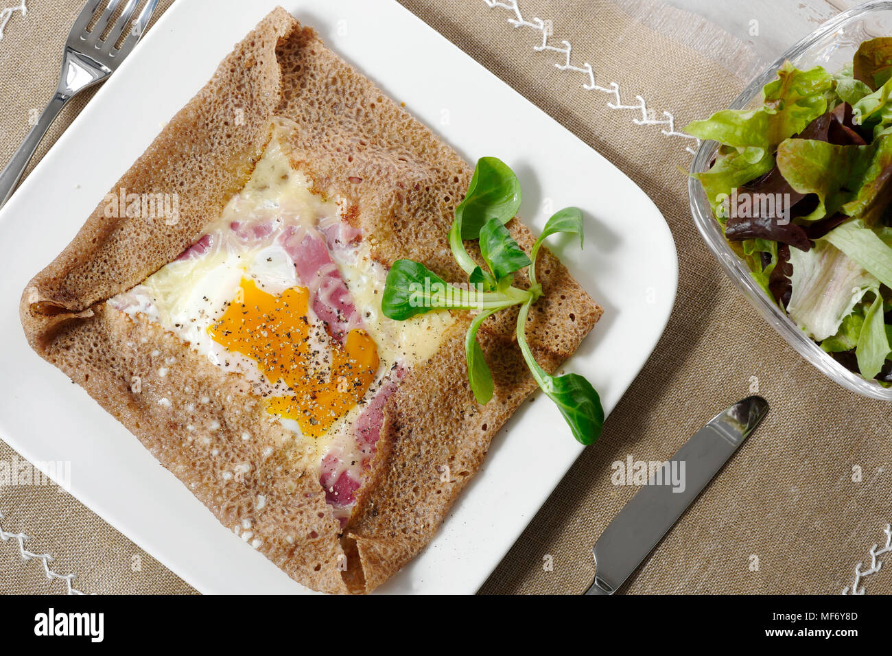 Breton crepe with egg in a white plate Stock Photo - Alamy