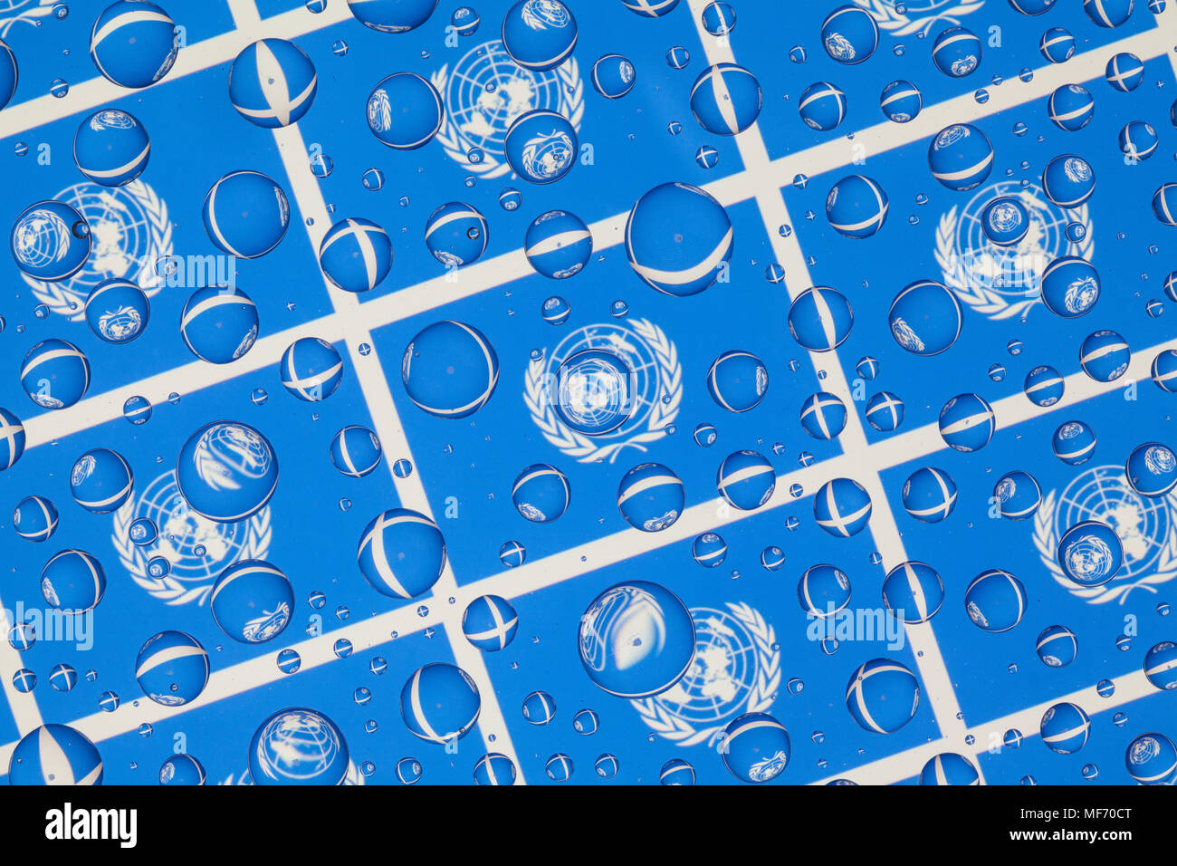 Flags of United Nation behind a glass covered with rain drops.Pattern ...