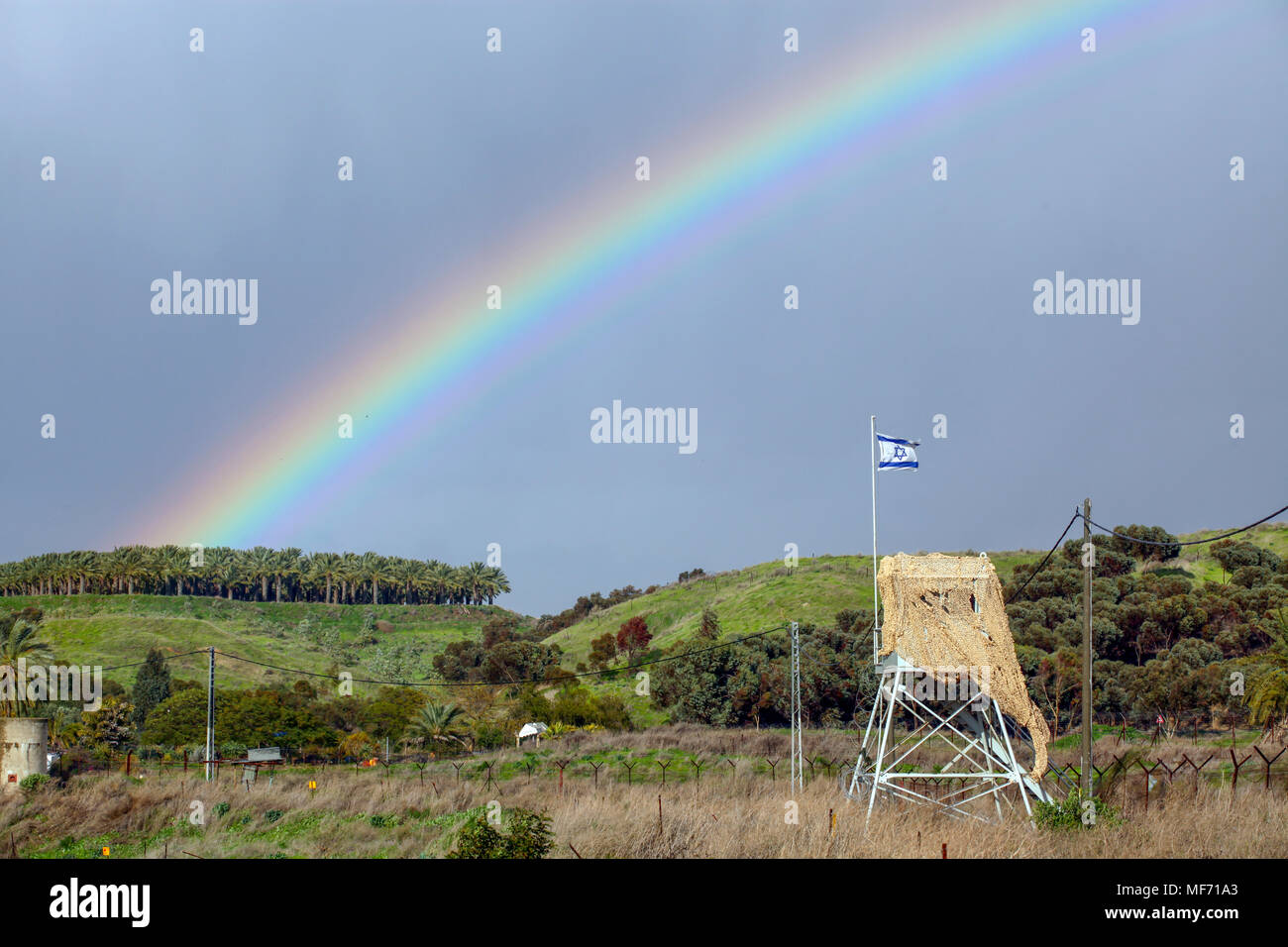 Rainbow over the Israeli flag. Photographed at the Isle of Peace at the ...