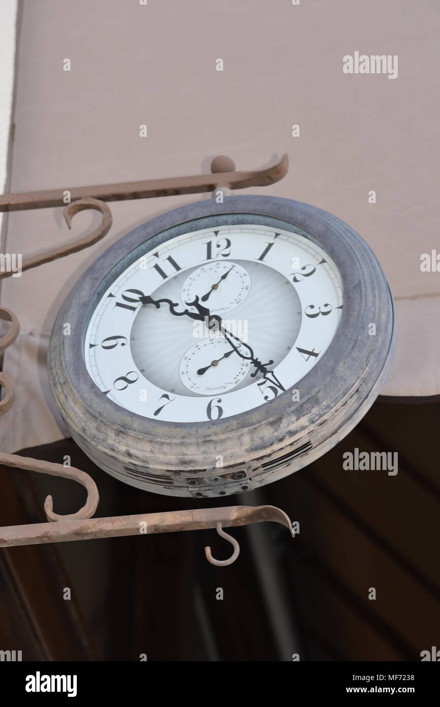 Antique clock on wall mount Stock Photo - Alamy