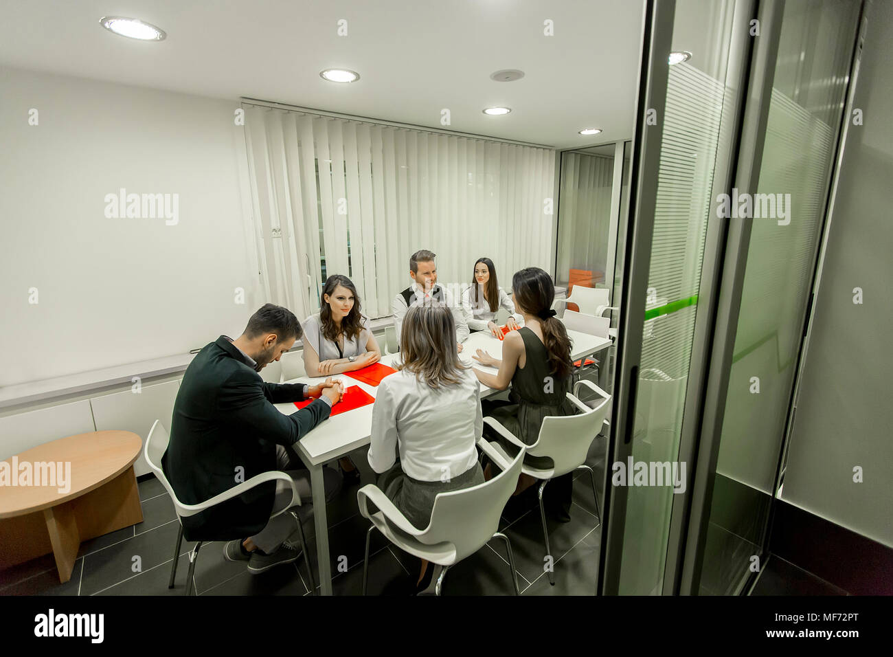 View at business people around table during staff meeting in the office ...