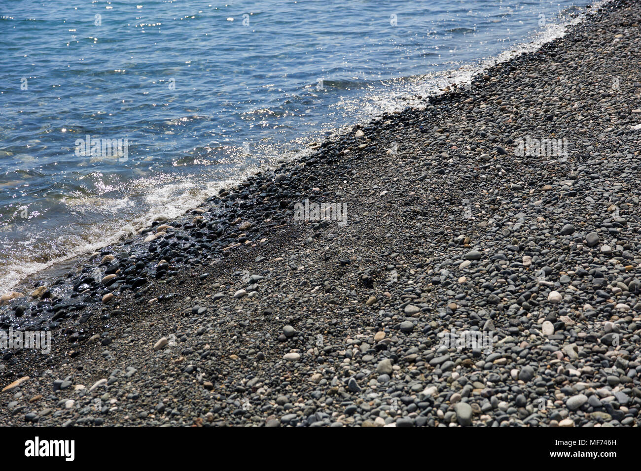 Detail of the cobble stone beach and sea Stock Photo - Alamy