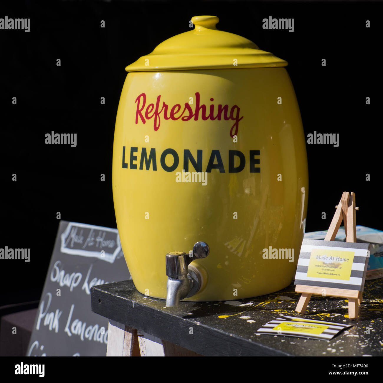 Tapped bright yellow container for dispensing Home made sharply lemon ...