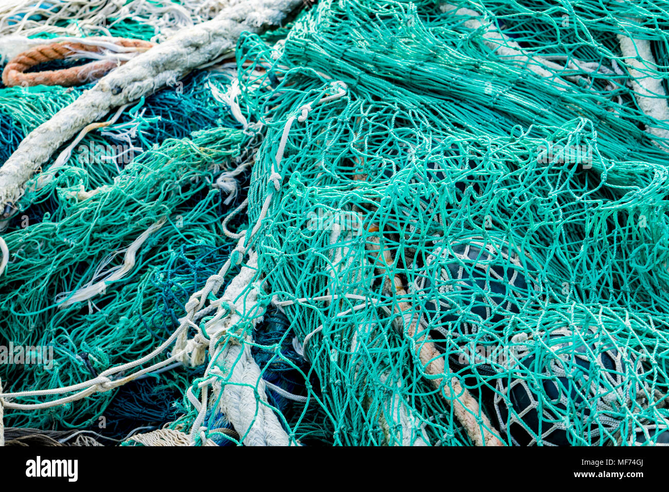 Closeup view at the fishing net on the boat Stock Photo - Alamy