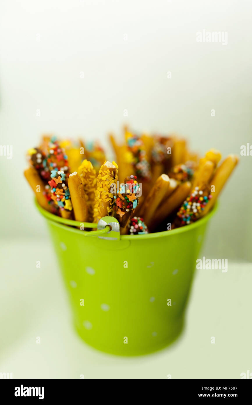 green bucket with sweets Stock Photo - Alamy