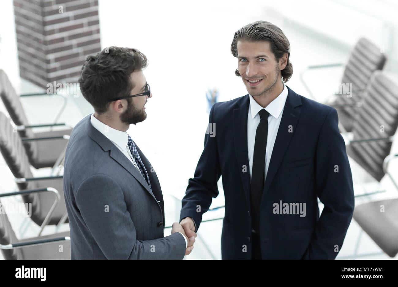 handshake business partners to the conference room Stock Photo - Alamy