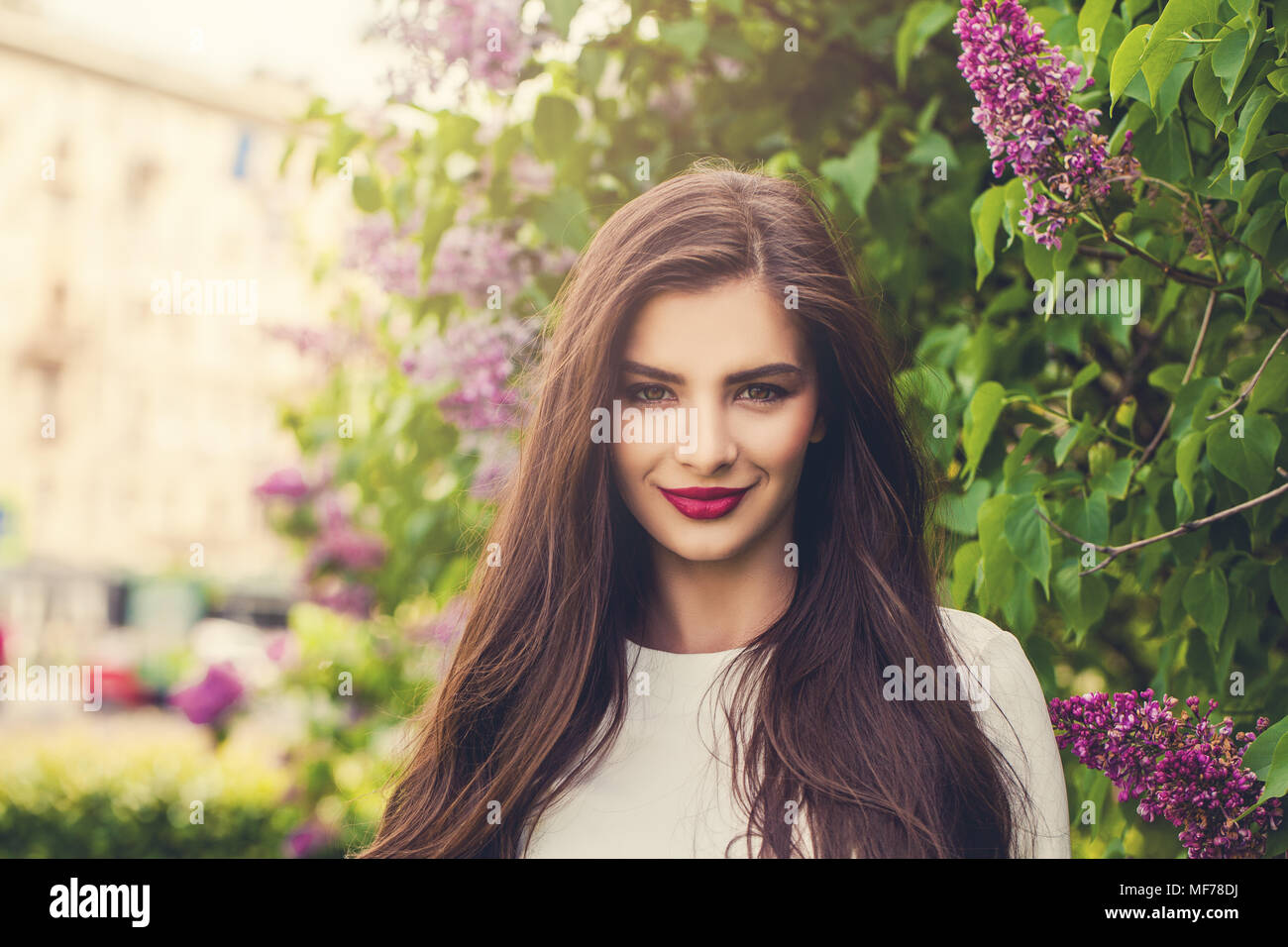 Young perfect woman with long brown hair and makeup. Beautiful female ...