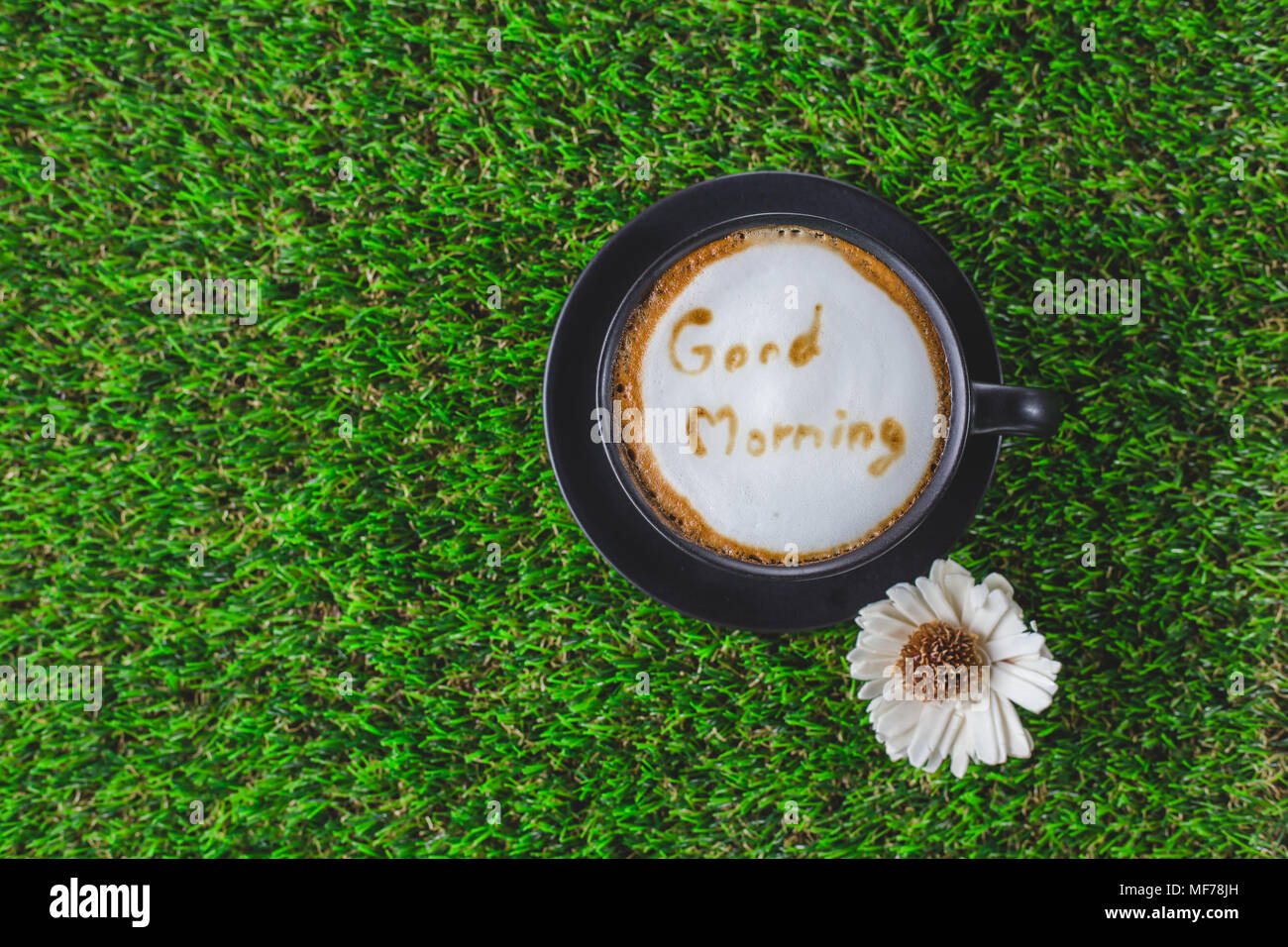 Top view Text Good Morning on wooden table with cup of coffee and ...