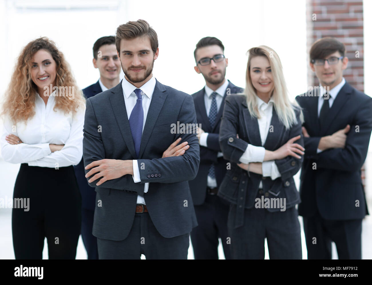 leader and a professional business team Stock Photo - Alamy