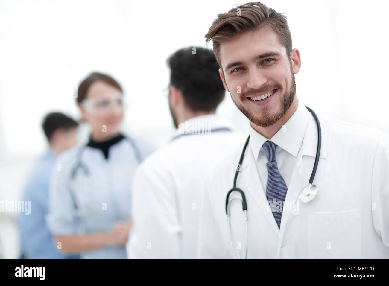 Portrait of friendly male doctor smiling Stock Photo - Alamy