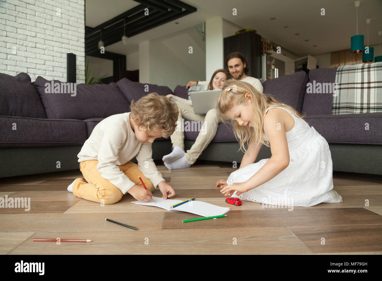 Children having fun drawing together, happy family leisure home Stock ...