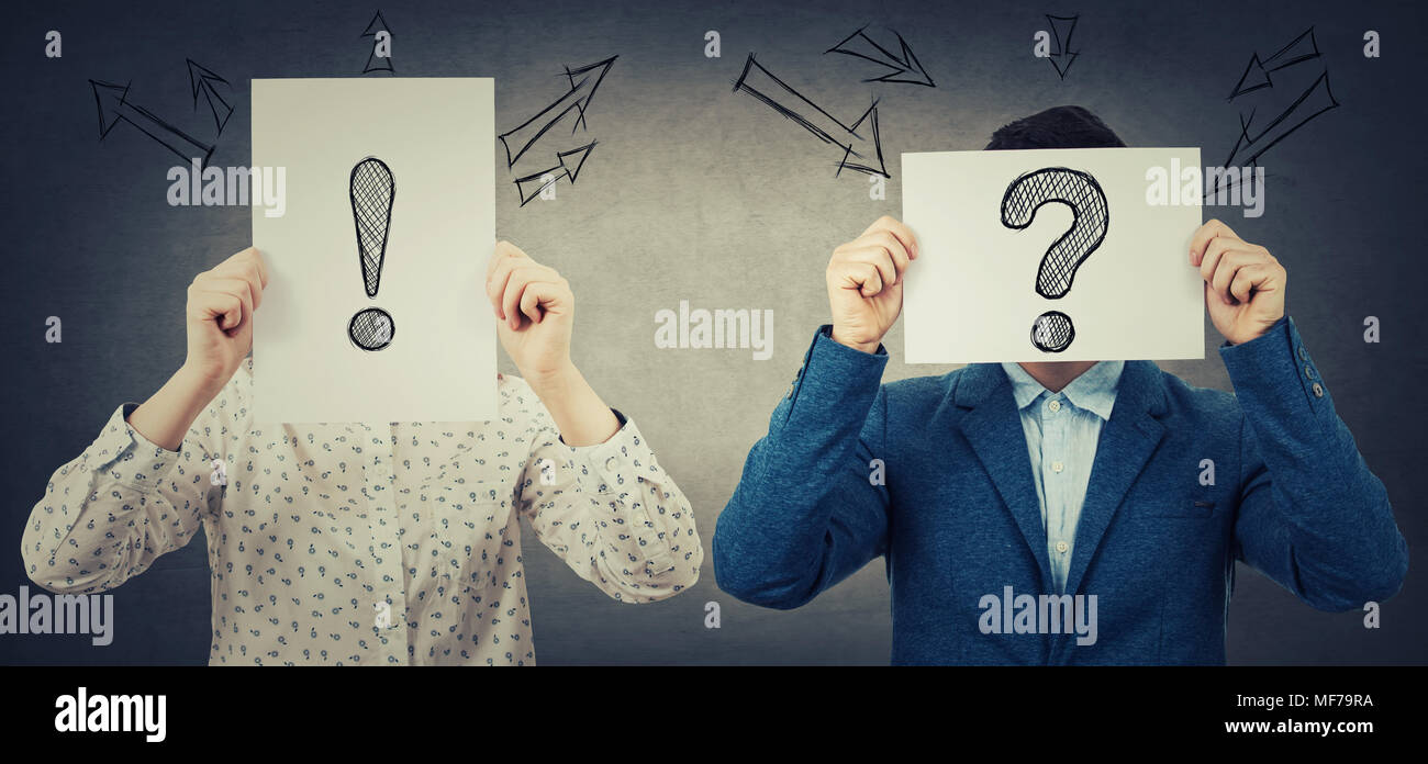 Businessman and businesswoman covering their faces using white paper ...
