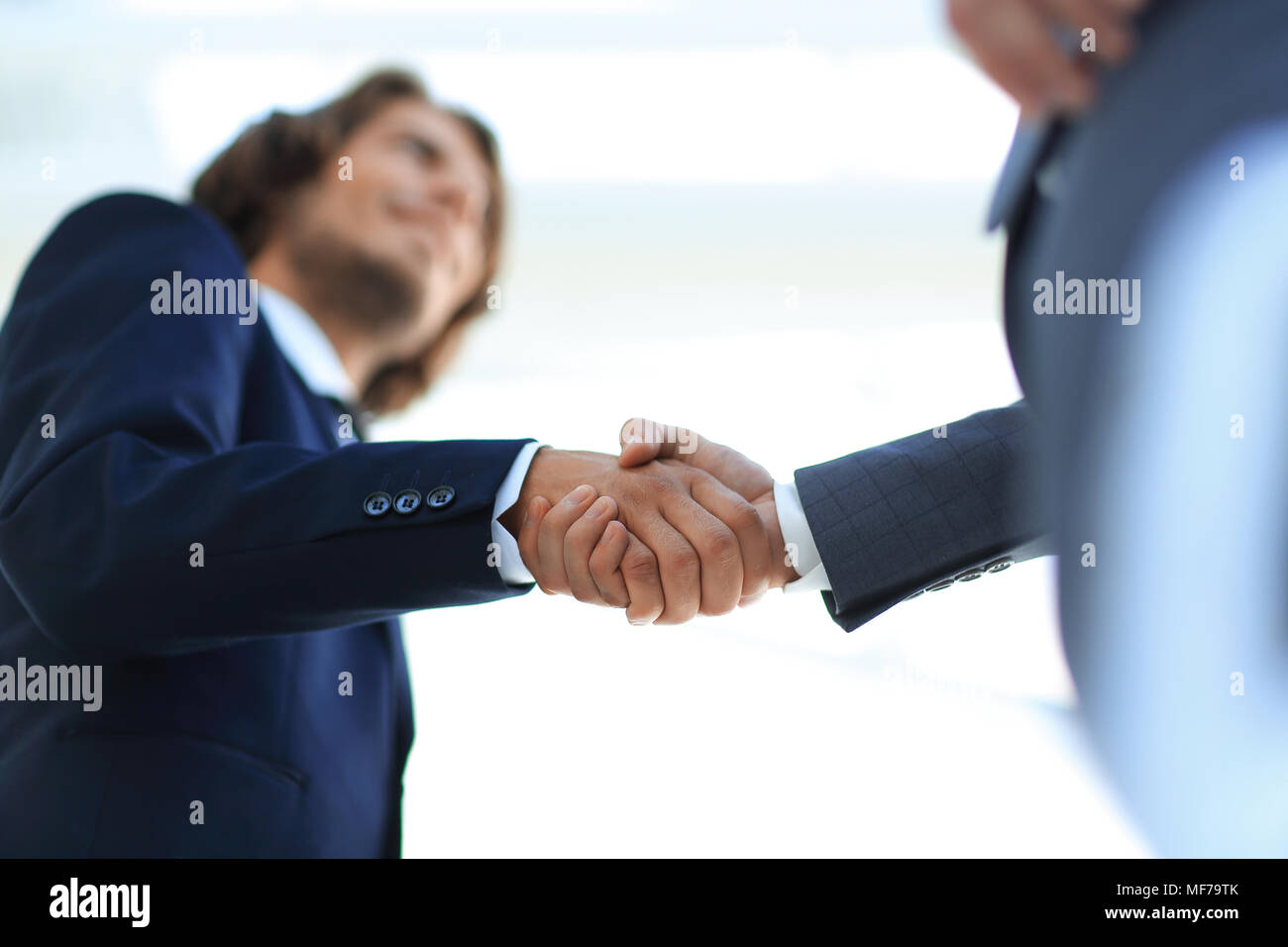 Successful business people handshaking after good deal Stock Photo - Alamy