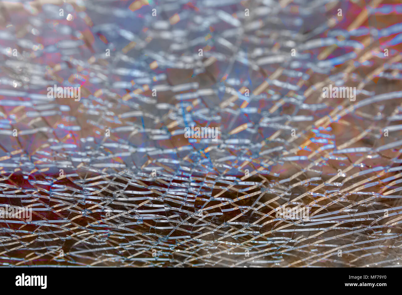 Abstract background: broken tempered glass texture. Selective focus ...
