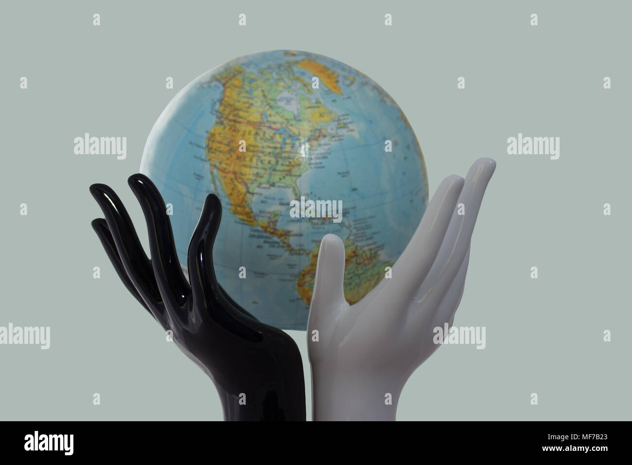 Symbol of peace and cooperation. Hands support globe on white ...