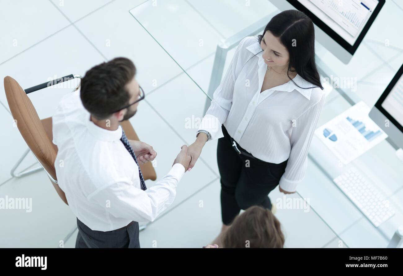 handshake manager and employee near the workplace Stock Photo - Alamy
