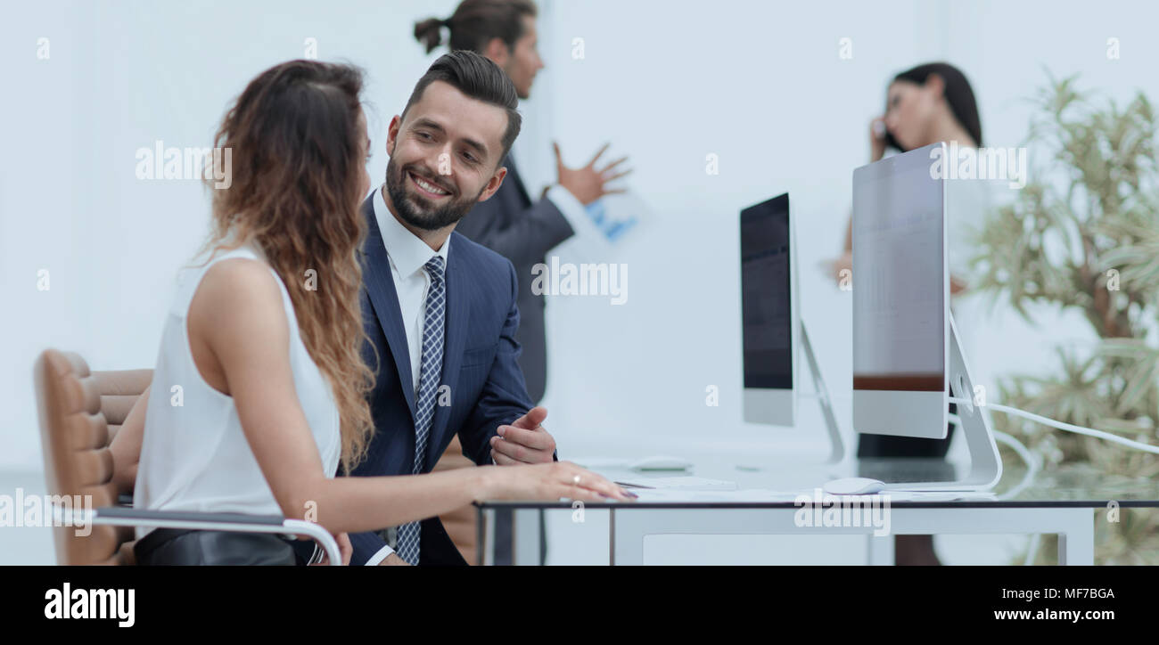 colleagues talking, sitting at your Desk Stock Photo - Alamy