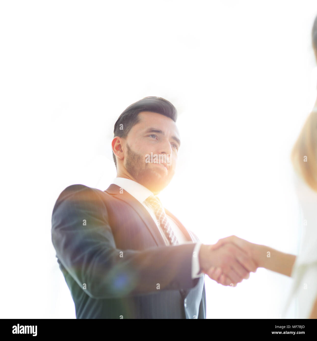 Two business workers shake hands in office Stock Photo - Alamy