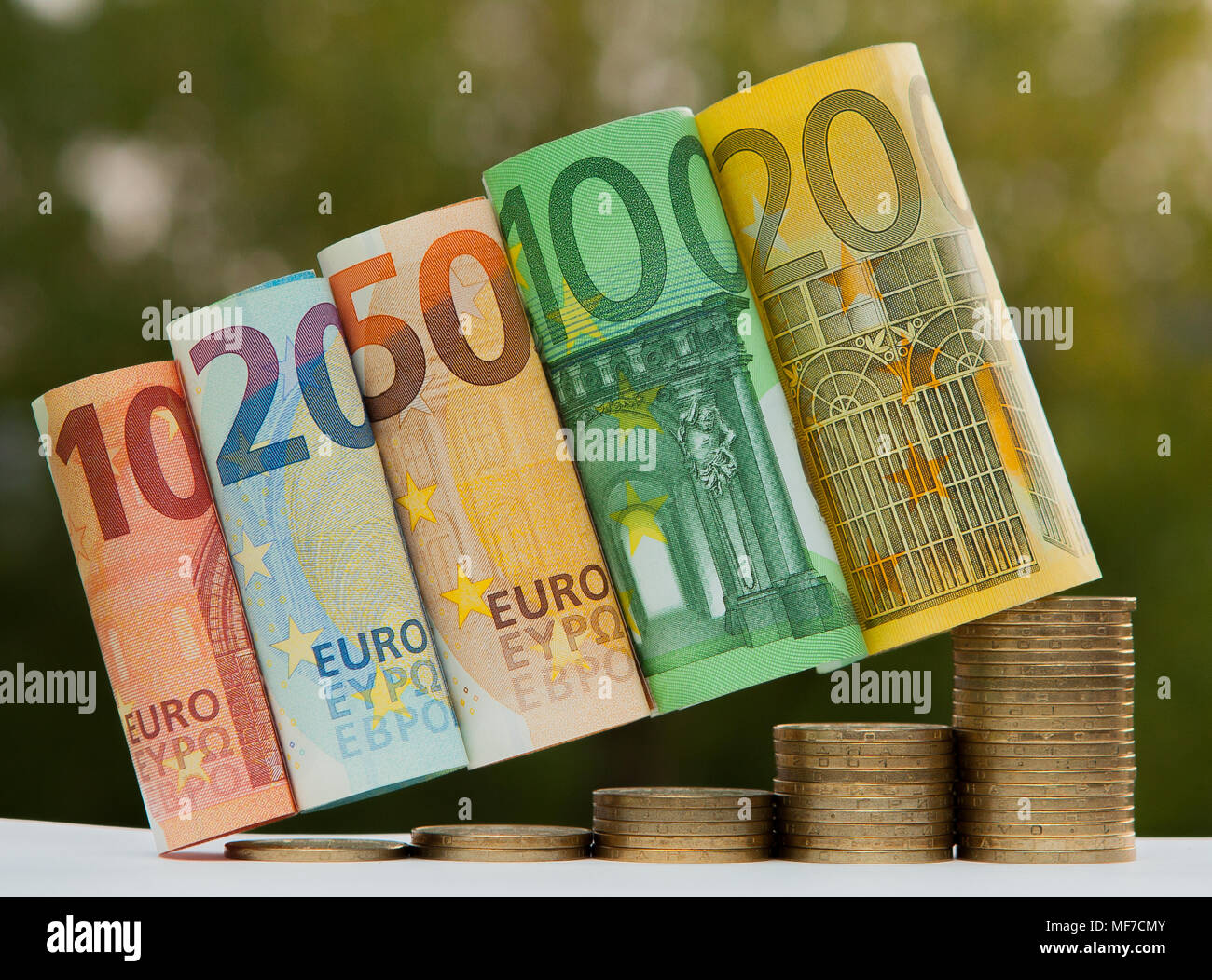 Ten, twenty, fifty, one hundred, two hundred and coins euro rolled ...