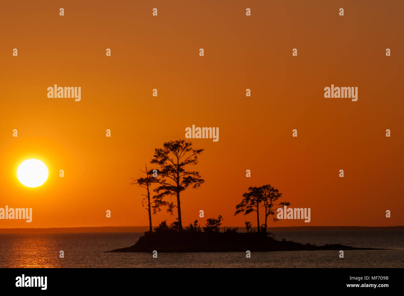 SMALL ISLAND SUNSET Stock Photo - Alamy