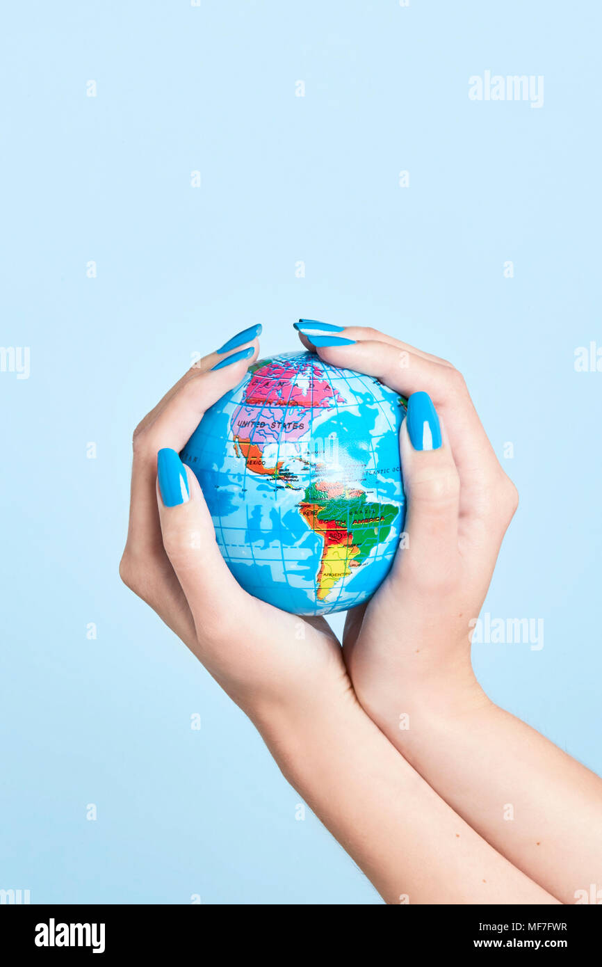 Hands holding globe hi-res stock photography and images - Alamy