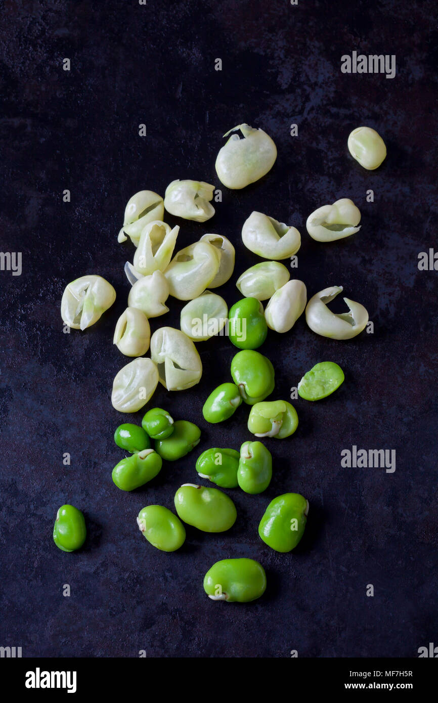 Peeled broad beans on dark ground Stock Photo - Alamy