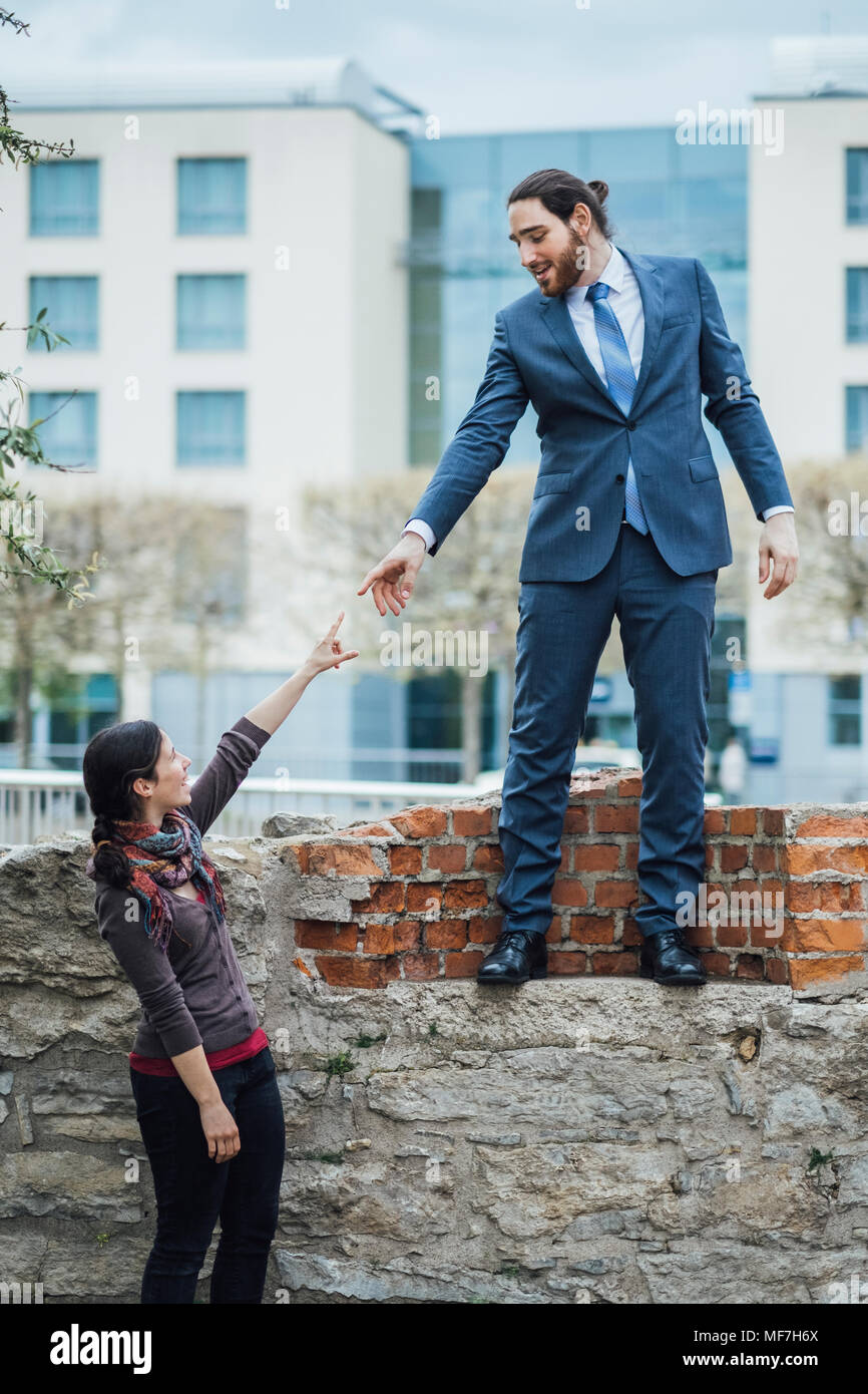 Woman reaching hand down hi-res stock photography and images - Alamy