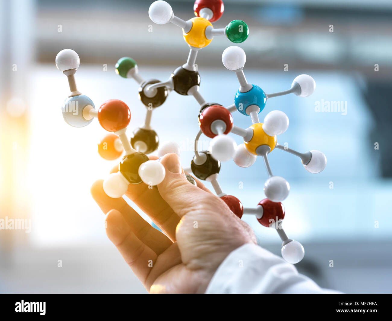 Scientist holding a molecule model hi-res stock photography and images ...