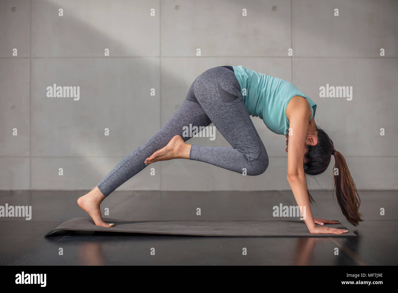 Young female doing exercises lifting hi-res stock photography and ...