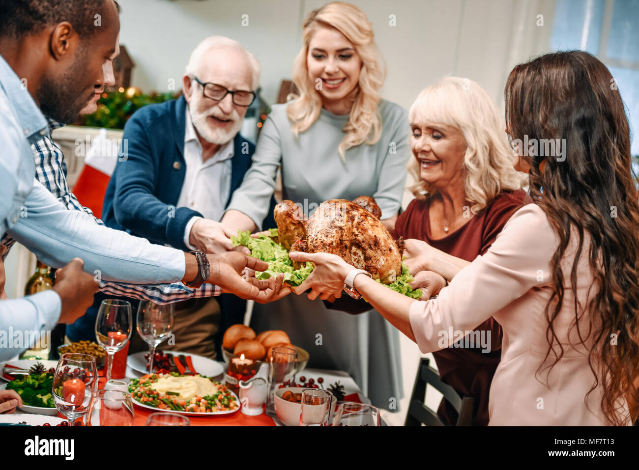 family holding christmas turkey Stock Photo - Alamy