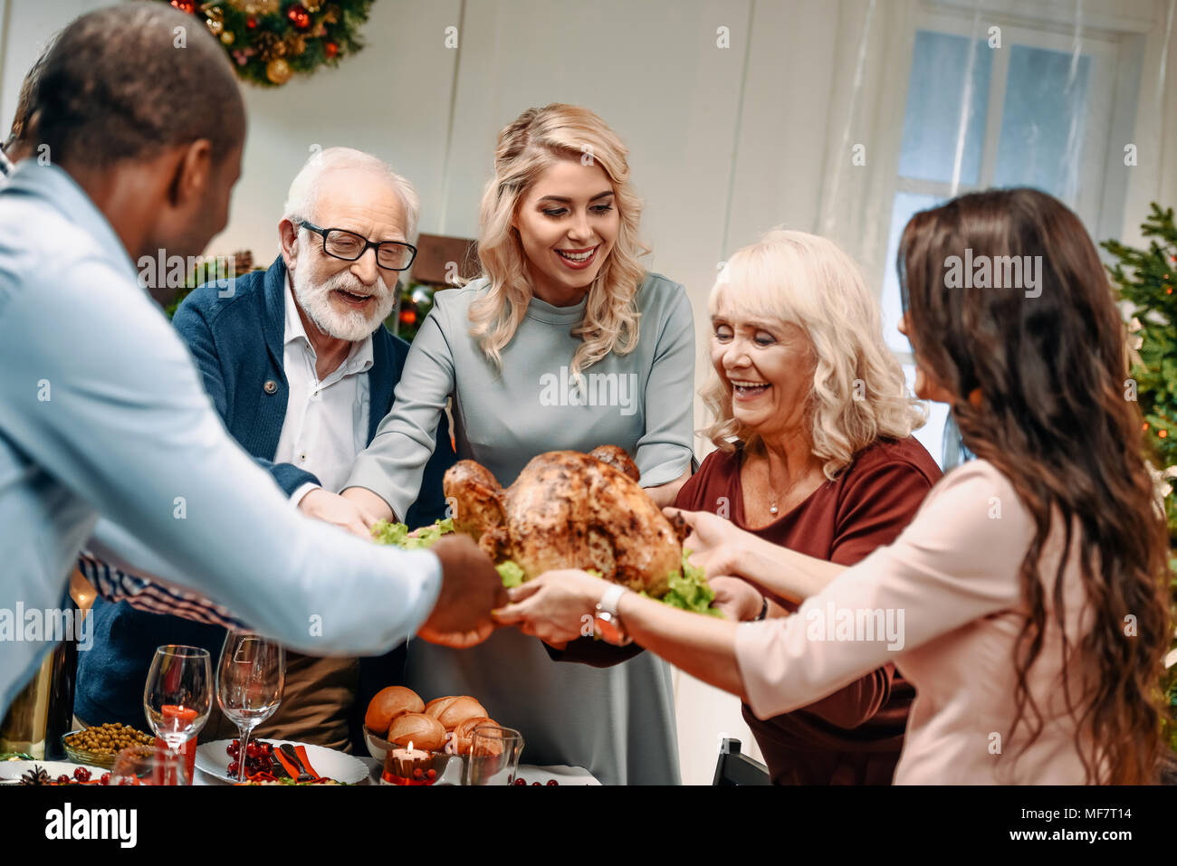 family holding christmas turkey Stock Photo - Alamy