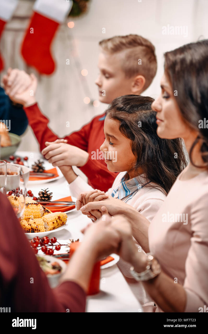 family praying before christmas dinner Stock Photo - Alamy
