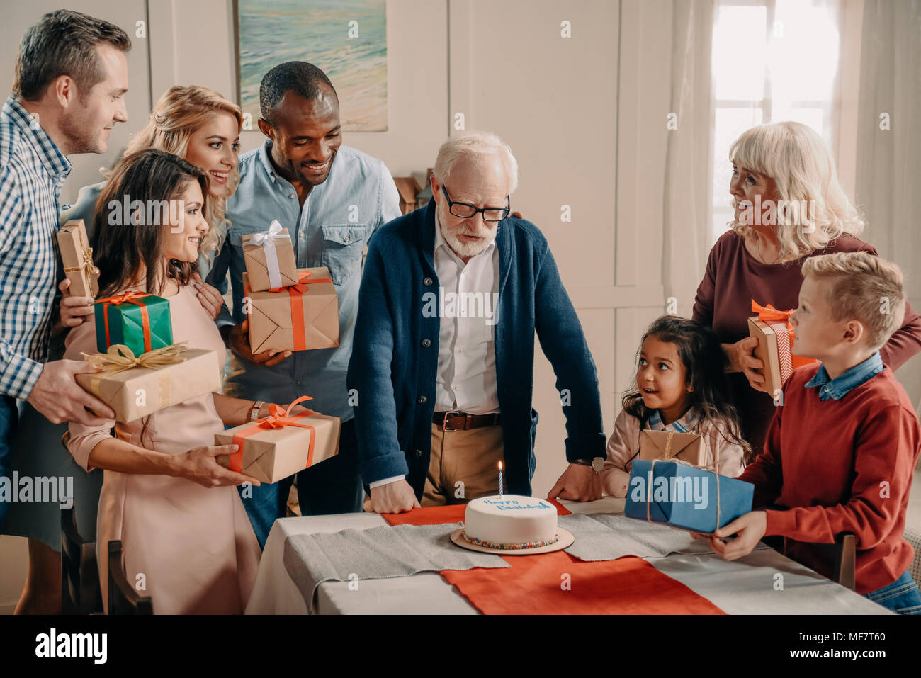 large family celebrating birthday Stock Photo - Alamy