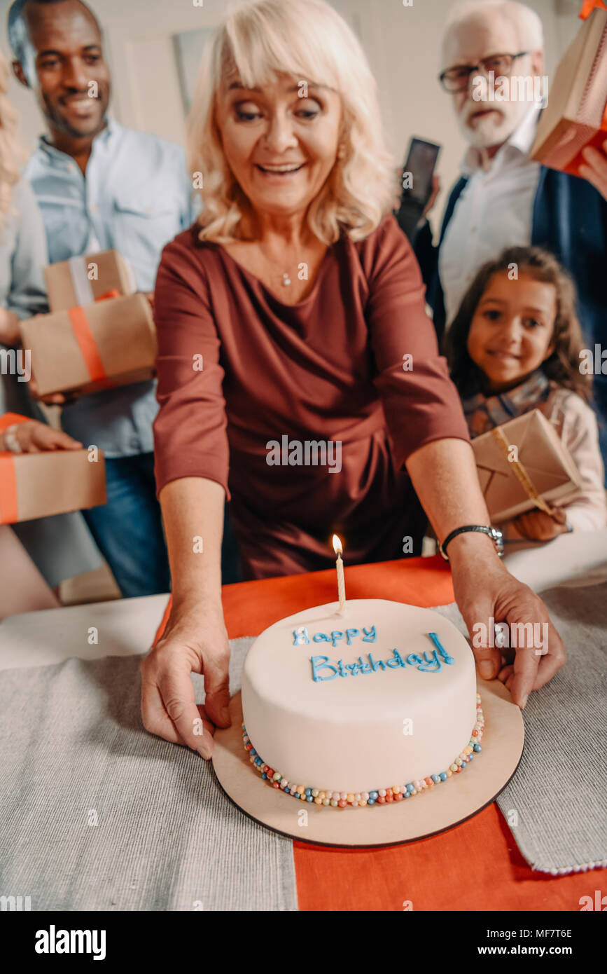 Woman presenting birthday cake hi-res stock photography and images - Alamy